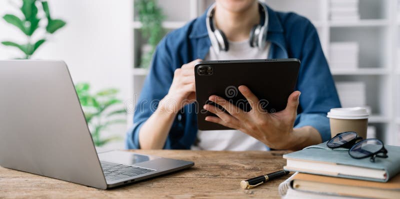 Male are Using Tablet To Work at the Desk in the Morning Stock Photo ...