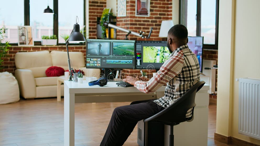 Male Video Creator Edits a Multimedia Project at a Modern Office Stock ...