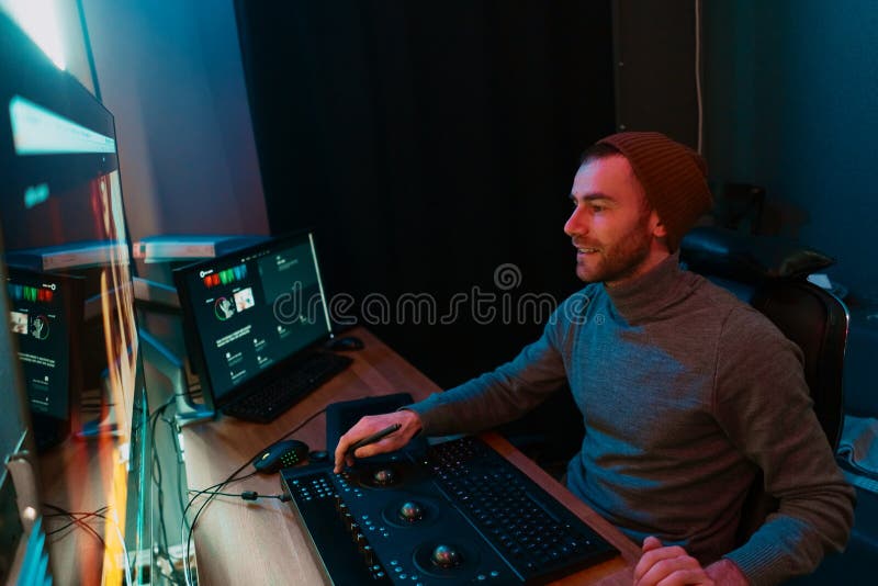 Male Video Editor Working on His Personal Computer with Big Display ...