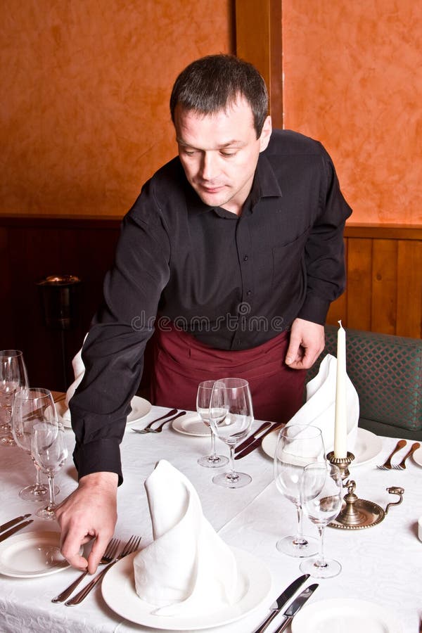Male Waiter Arranges Dishes on the Table I Stock Photo - Image of model ...