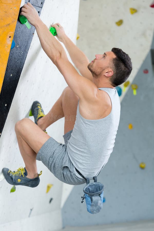 Male wall climber on move stock image. Image of alpines - 217134877