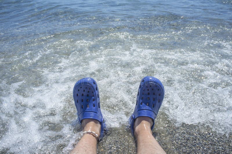 Male Wearing Blue Clogs beside the Beach Stock Photo - Image of coast ...