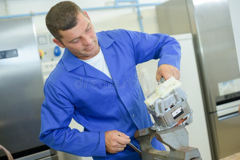 Male Worker during Appliance Assembling Work Stock Image - Image of ...