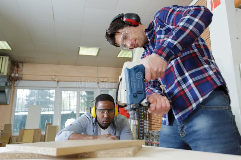Male Worker Behind Drilling Machine Stock Photo - Image of standing ...