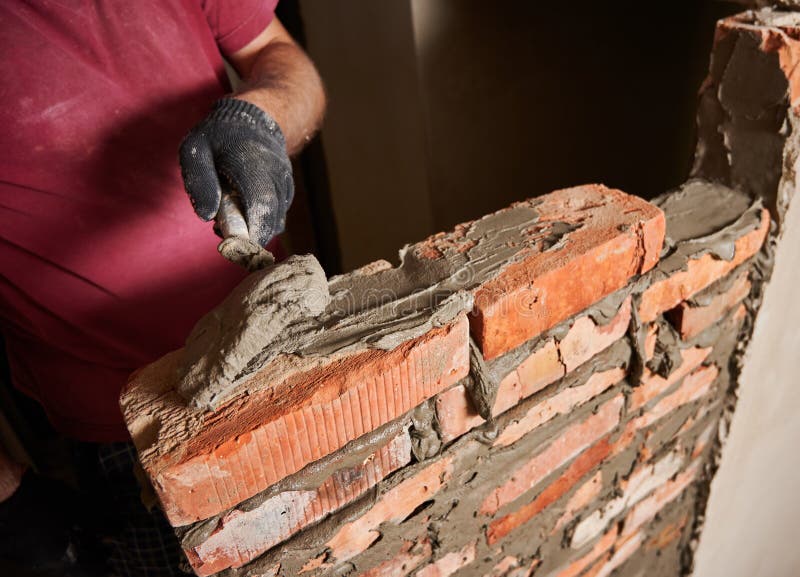 Male Worker Building Brick Wall at Constructing Site. Stock Image ...