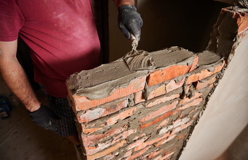 Male Worker Building Brick Wall at Constructing Site. Stock Photo ...
