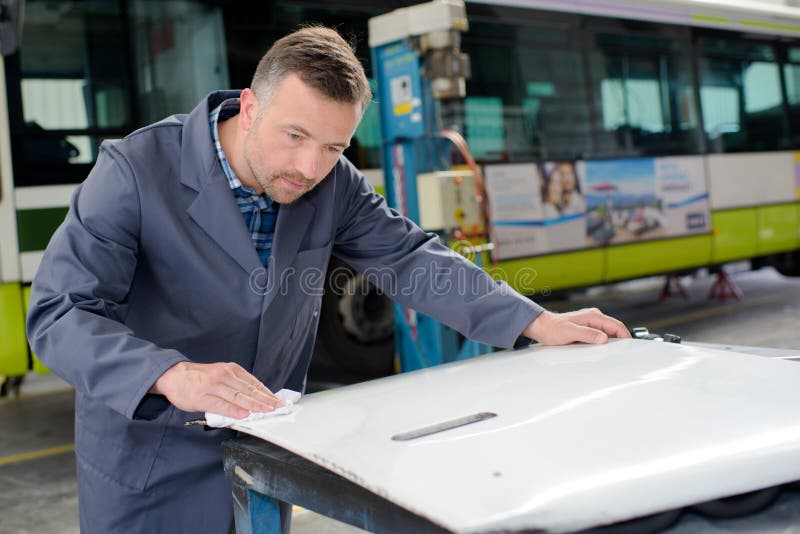 Male Worker during Bus Maintenance Stock Photo - Image of young ...