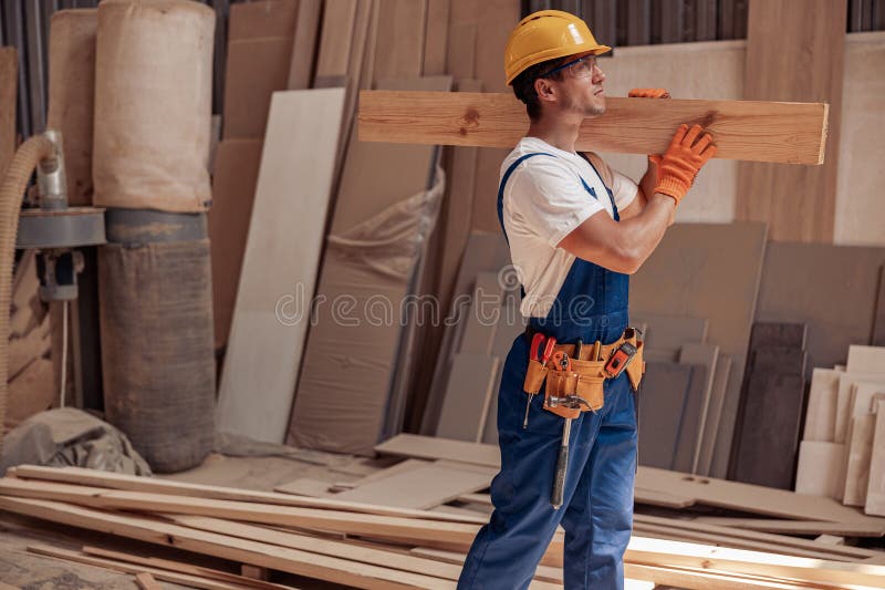 Male Worker Carrying Timber Wood Plank at Construction Site Stock Image ...