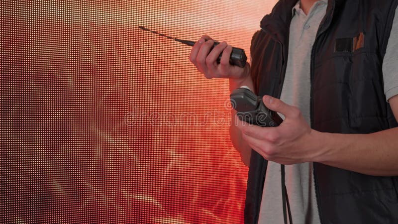 Male Worker Checking Big Led Screen. Technician with Lux Meter Device ...