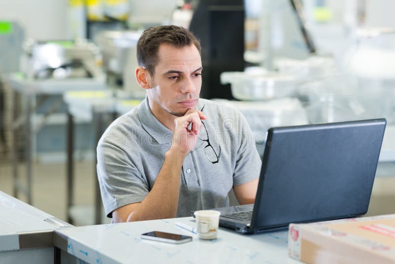 Male Worker Checking Laptop Stock Photo - Image of electronic ...