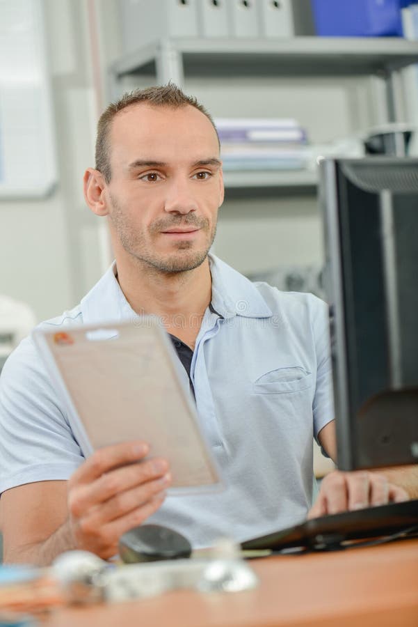 Male Worker Checking Stock Levels Stock Image - Image of examine ...