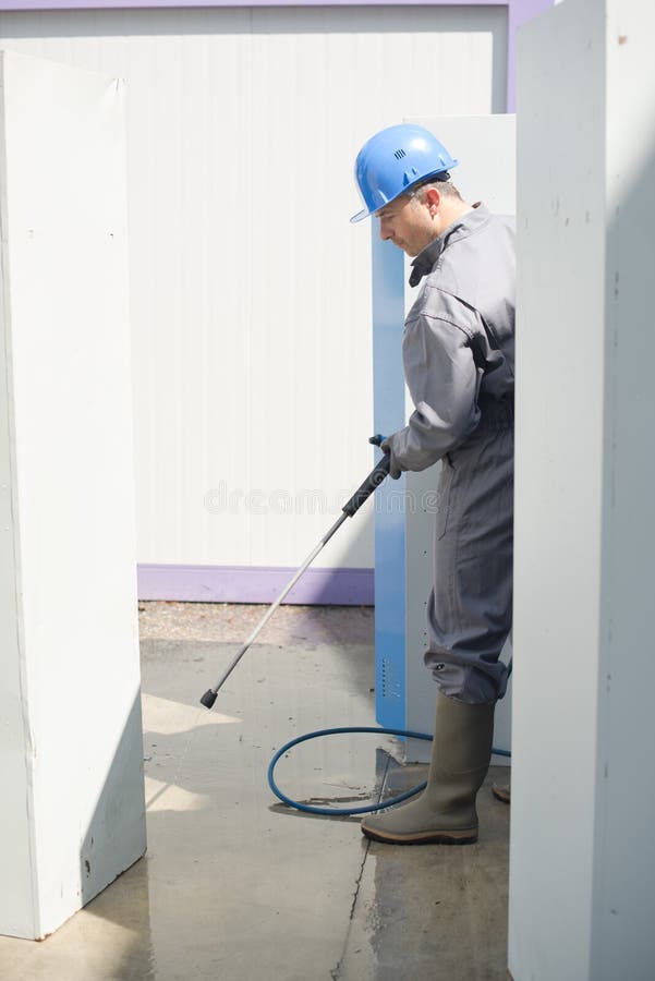 Male Worker Cleaning Building Stock Image - Image of hose ...