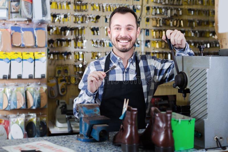 Male Worker Demonstrating His Tools for Making Keys Stock Photo - Image ...