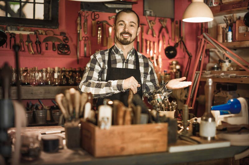 Male Worker Demonstrating Workplace and Tools in Leather Stock Image ...
