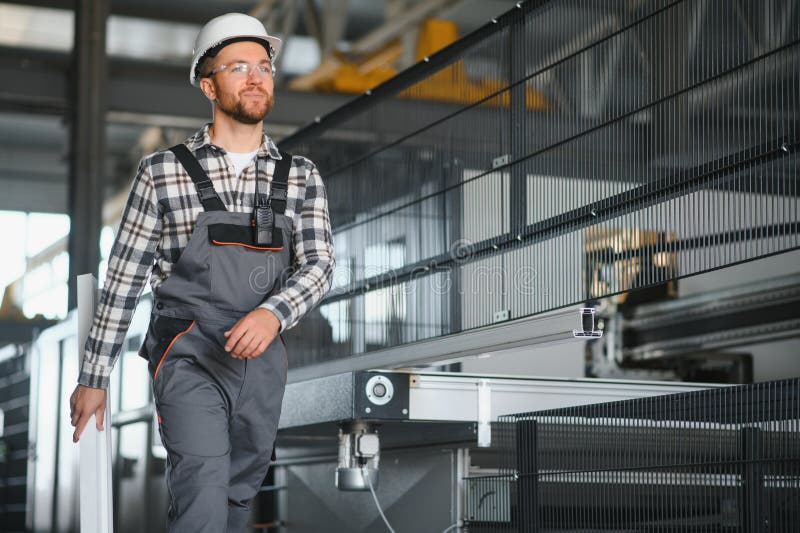 Male worker at a factory stock photo. Image of manual - 334797278