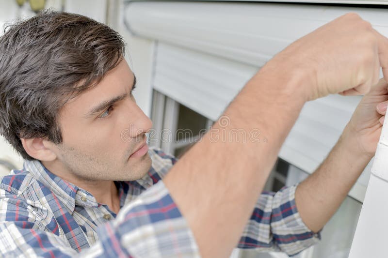 Man fitting window blind stock image. Image of screwdriver - 275397575