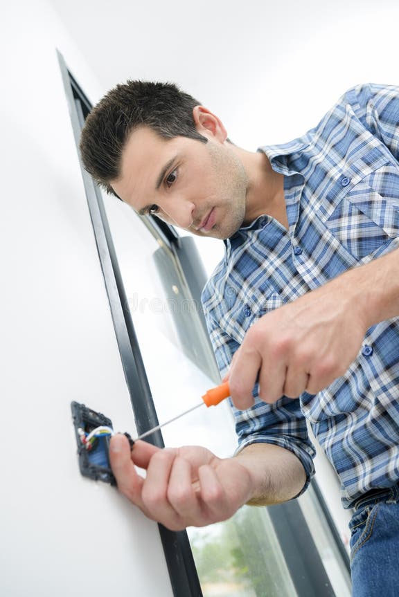 Male worker fixing socket stock image. Image of suave - 338944927