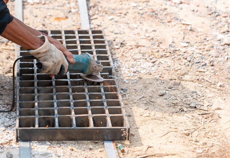 Male Worker Grinding at Grille Weld Plate Stock Image - Image of ...
