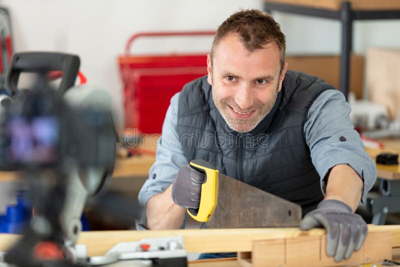 Male Worker in Hand Sawing Wood Stock Photo - Image of handsaw ...