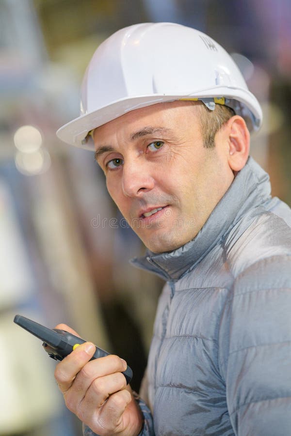 Male Worker Holding Radio Communication Gadget Posing Stock Photo ...