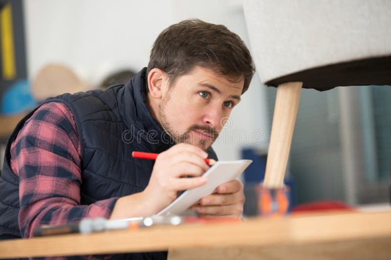 Male Worker Inspecting Chair Stock Photo - Image of interior, sketch ...