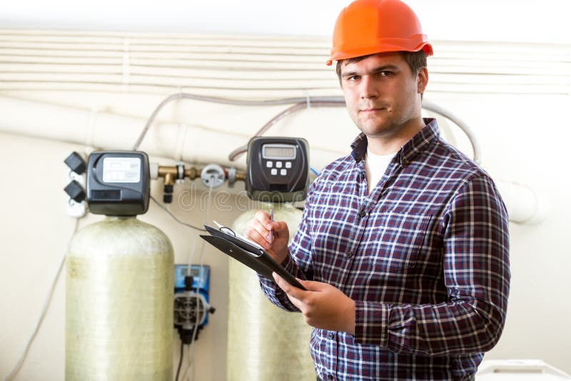 Male Worker Inspecting Work of Industrial Equipment Stock Image - Image ...