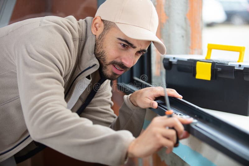 Male Worker Installing Sill on External Pvc Window Frame Stock Photo ...