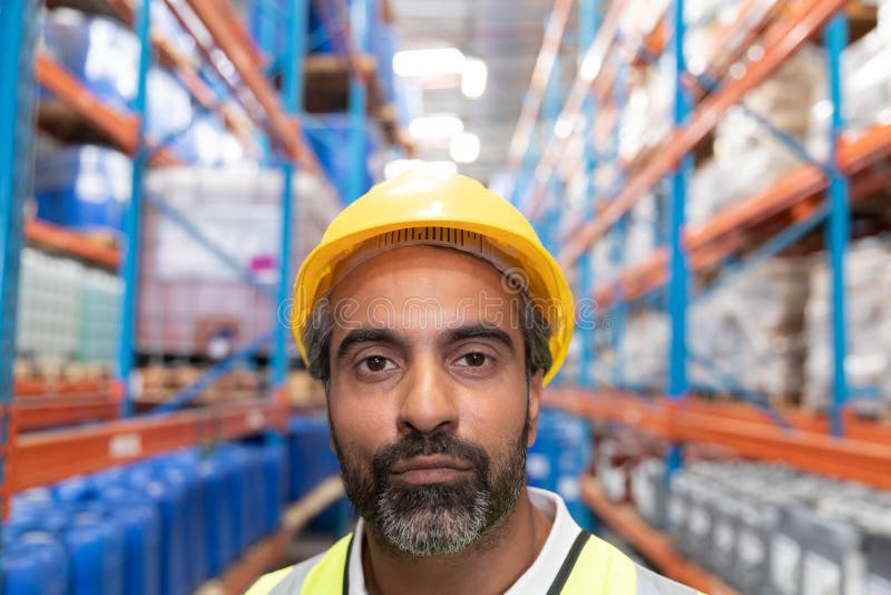 Male Worker Looking at Camera in Warehouse Stock Image - Image of ...