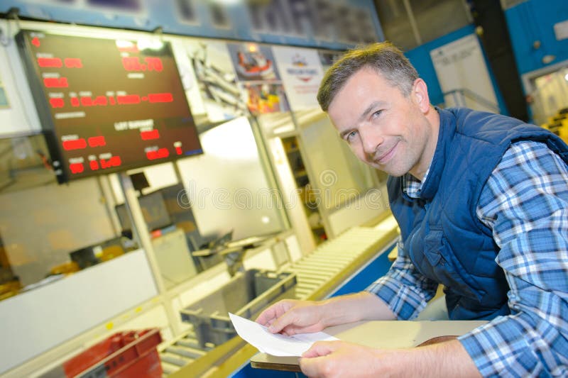 Male Worker Looking at List Stock Image - Image of price, work: 238087307