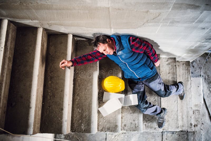 Male Worker Lying on the Stairs after Fall. Work Injury, Accident in ...