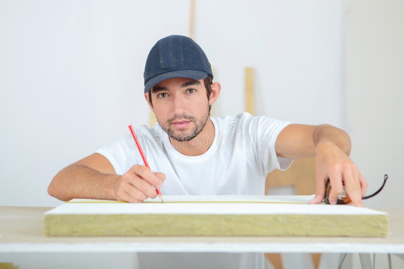 Male Worker Measuring Insulation Stock Photo - Image of construction ...