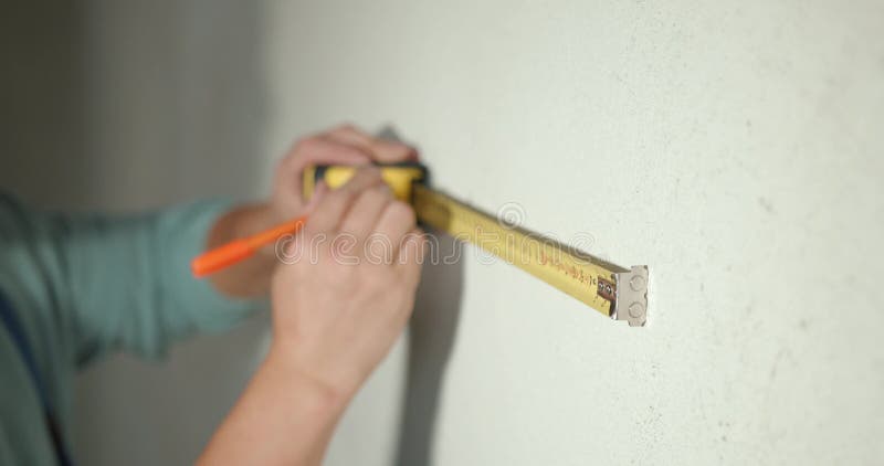 Male Worker Measuring the Wall with a Tape Stock Footage - Video of ...
