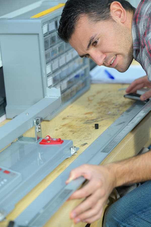 Male Worker Measuring Workspace Stock Image - Image of intelligent ...
