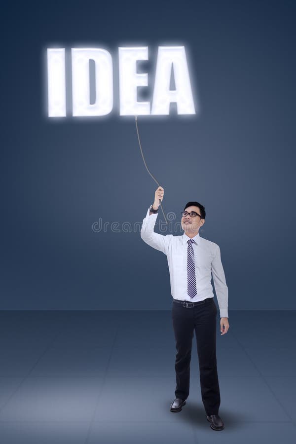 Male Worker Pulling an Idea Text Stock Photo - Image of idea, manager ...