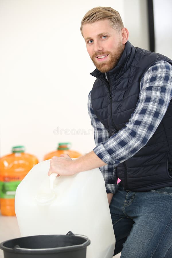 Male Worker Putting Liquid in Container Stock Image - Image of design ...