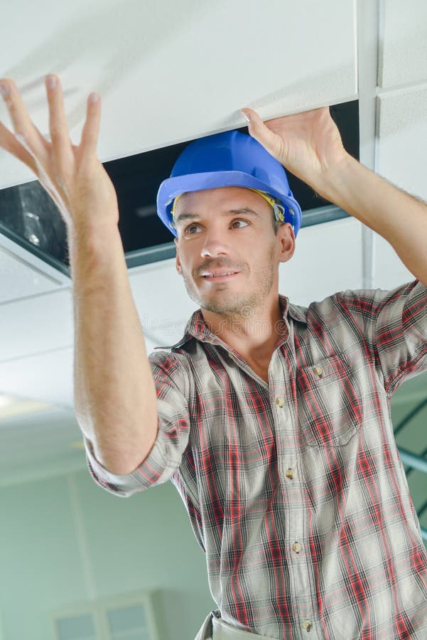 Male Worker Removing Ceiling Panels Stock Image - Image of installing ...