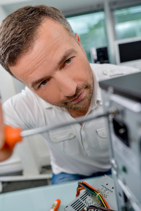 Male Worker Repairing Old Pc Stock Photo - Image of fixing, industry ...