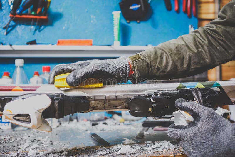 Male Worker Repairing Stone, Edge Sharpening in Ski Service Workshop ...
