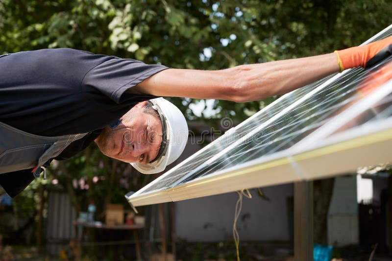 Man Solar Technician Installing Solar Panel Outdoors. Stock Photo ...