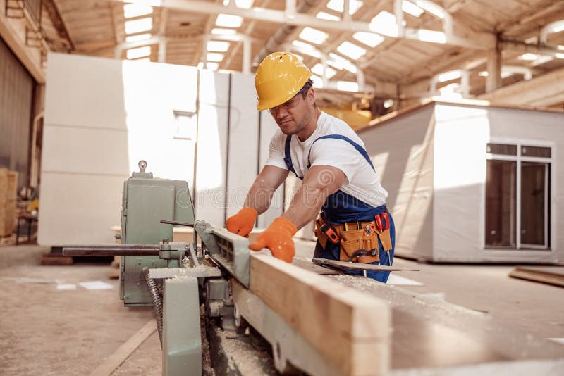 Handsome Young Man Using Woodworking Machine in Workshop Stock Photo ...