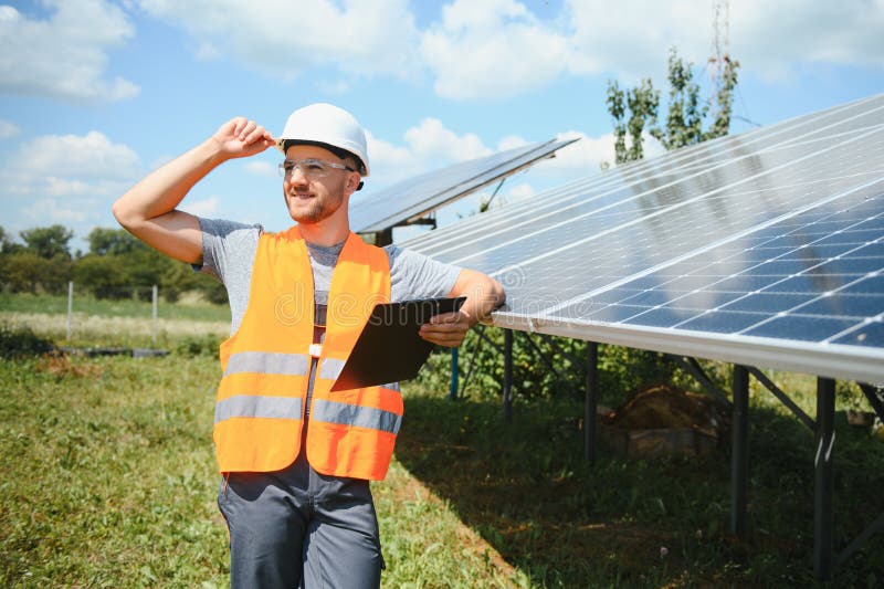 Male Worker with Solar Batteries. Man in a Protective Helmet Stock ...