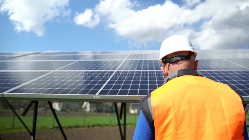 Male Worker in Special Uniform and Protective Helmet Works Fixing on ...