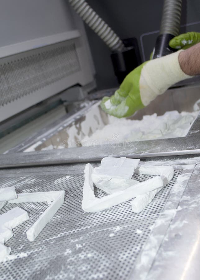 Worker Taking Out Models of White Polyamide Powder and Cleaning Them ...