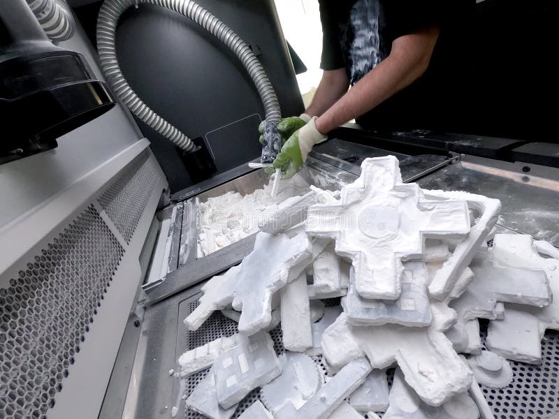 Worker Taking Out Models of White Polyamide Powder and Cleaning Them ...