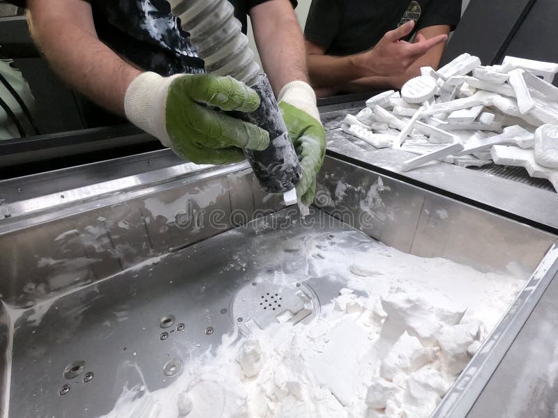 Worker Taking Out Models of White Polyamide Powder and Cleaning Them ...