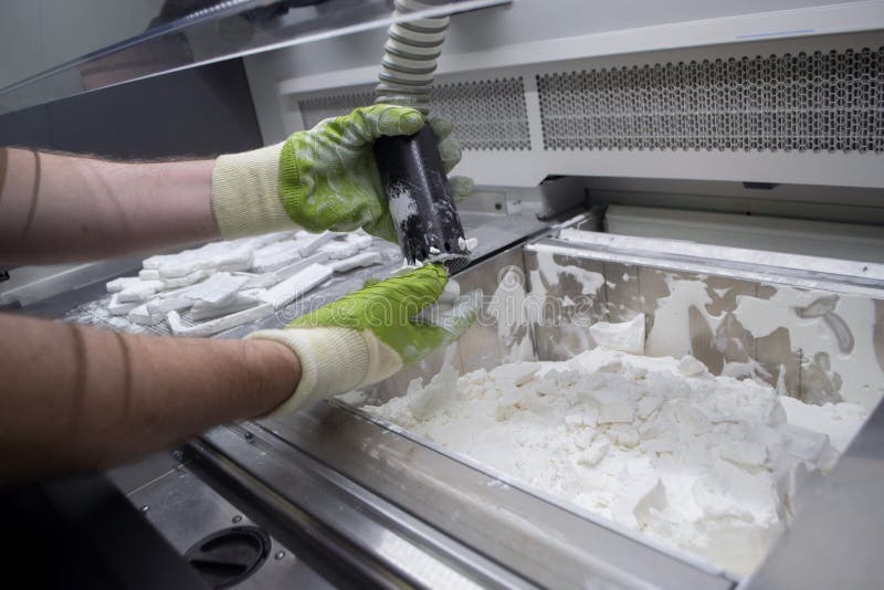Worker Taking Out Models of White Polyamide Powder and Cleaning Them ...