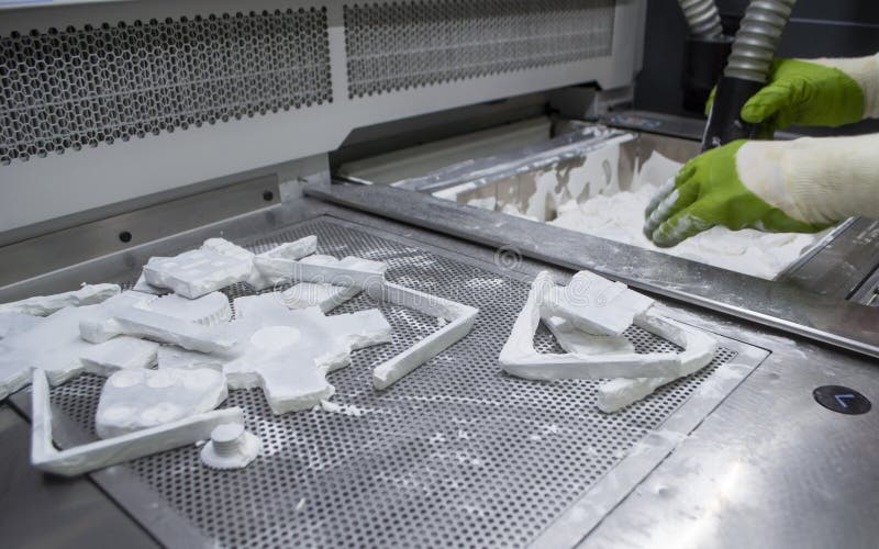 Worker Taking Out Models of White Polyamide Powder and Cleaning Them ...