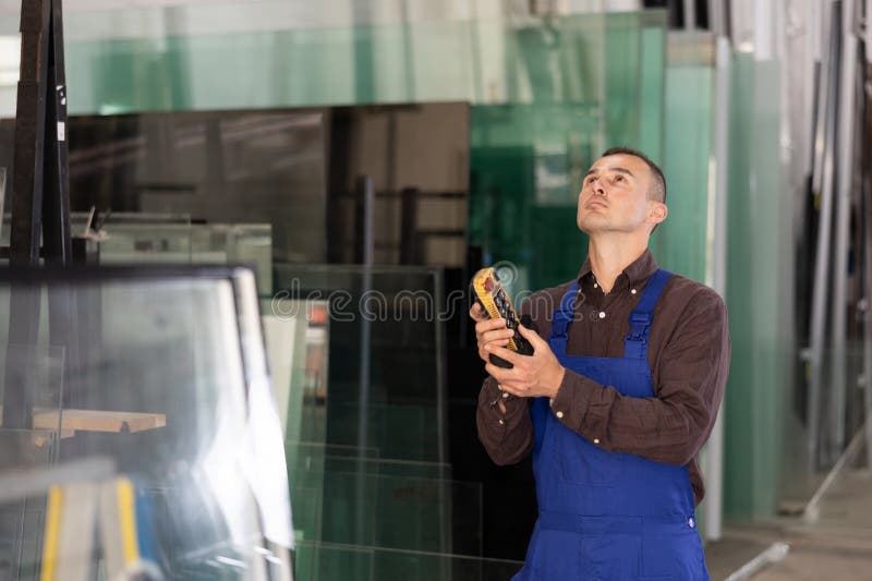 Male Worker Using Control Panel and Lifting Mechanism Controls Movement ...