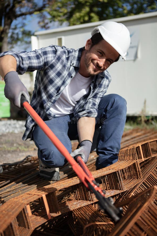 Male Worker Using Pliers at Building Site Stock Image - Image of ...