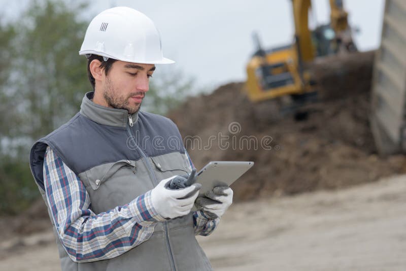Male worker using tablet stock image. Image of machine - 161831587